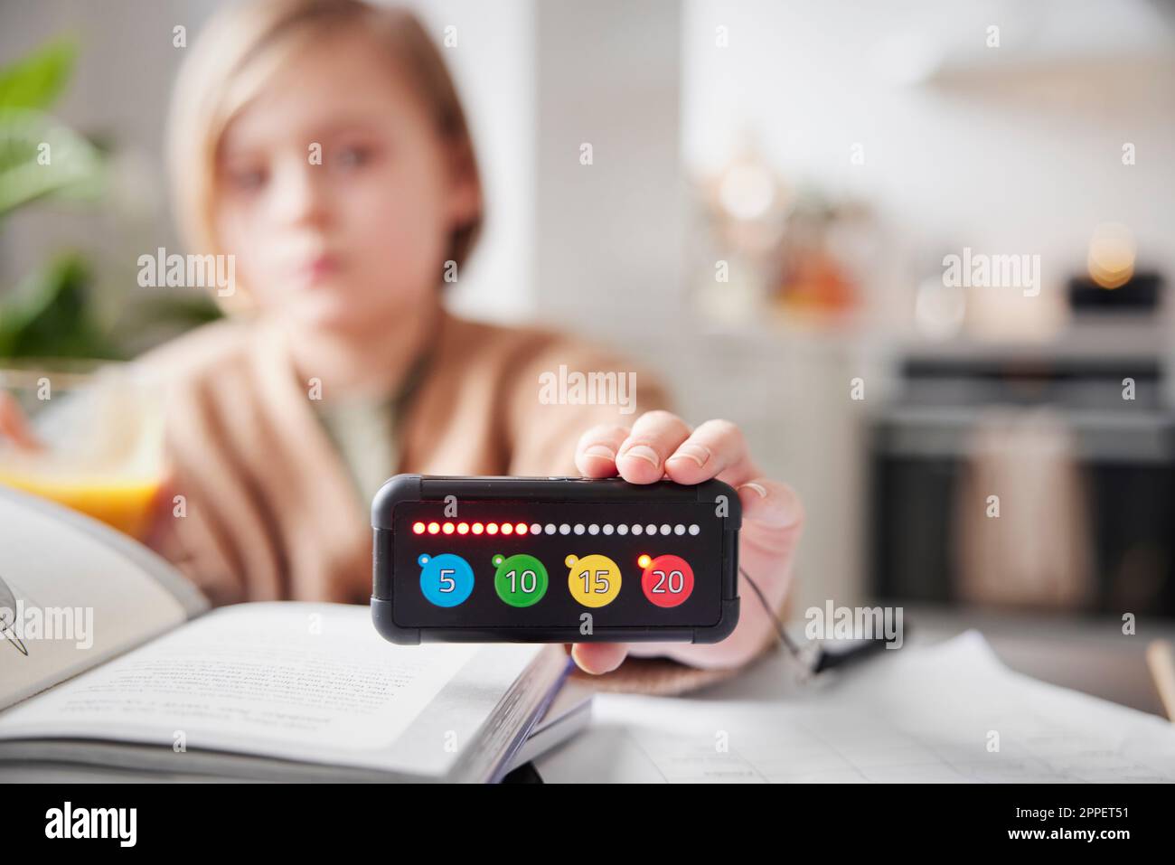 Child holding educational electronic game Stock Photo - Alamy