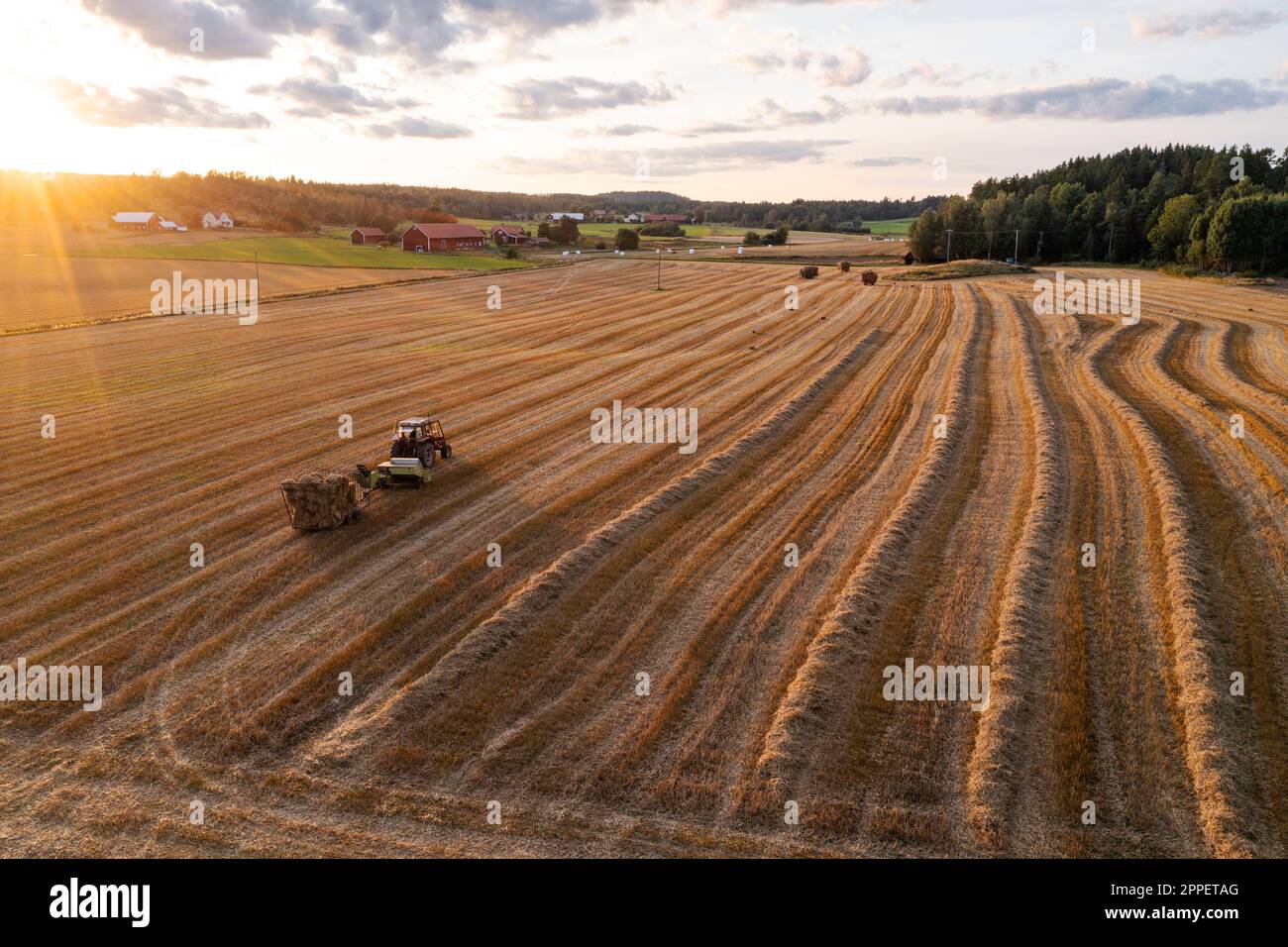 Aerial view of tractor working in field Stock Photo - Alamy