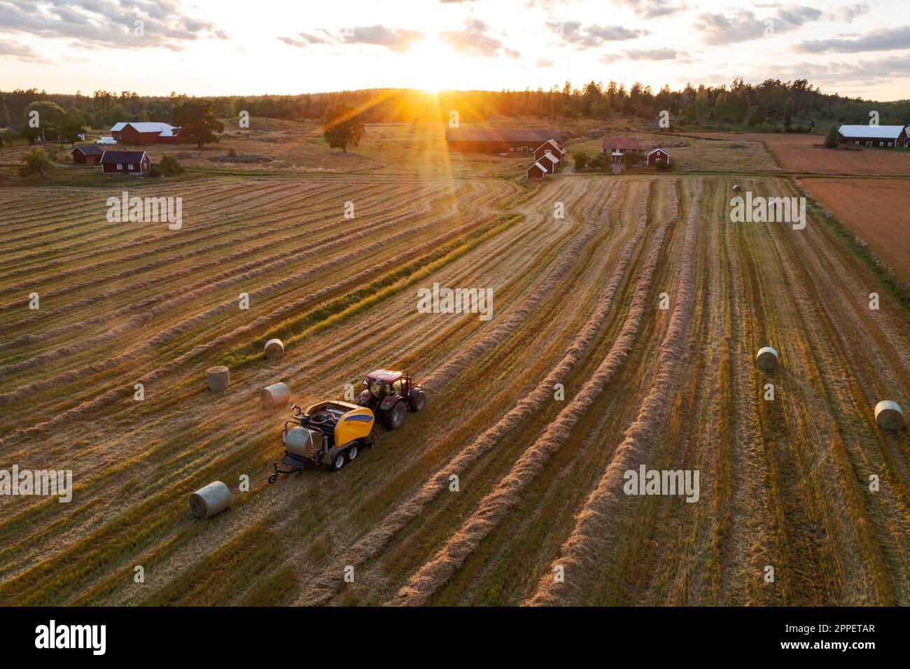 Aerial view of tractor working in field Stock Photo - Alamy