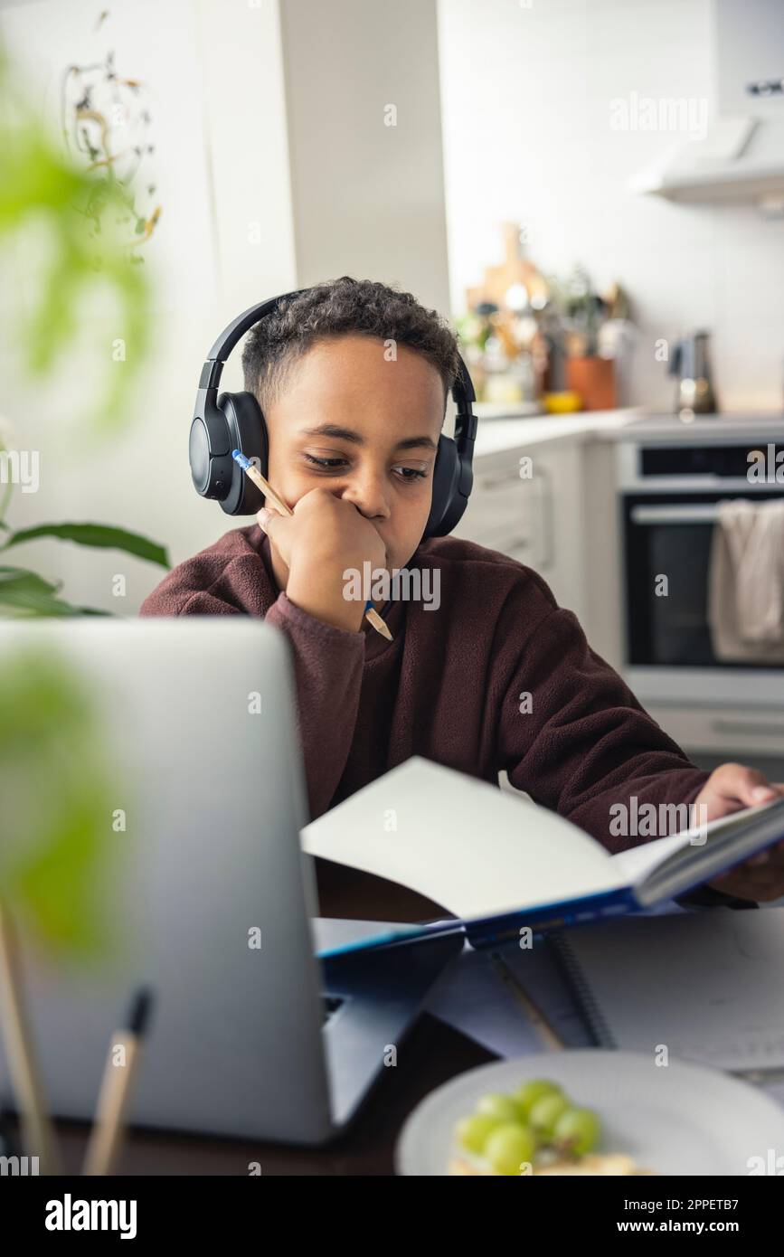 Schoolboy doing homework school hi-res stock photography and images - Alamy