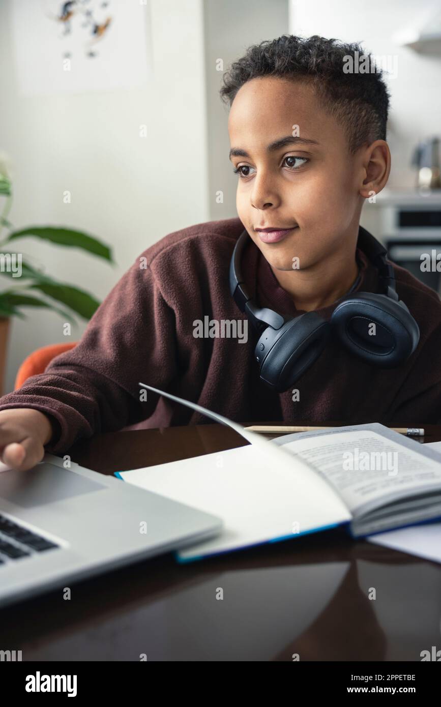 Boy doing homework at home Stock Photo - Alamy