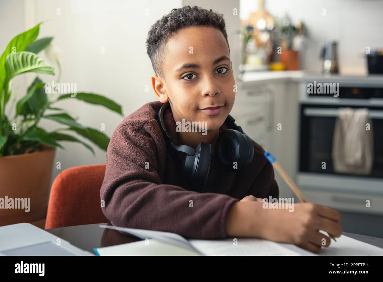 Schoolboy with brown hair hi-res stock photography and images - Alamy