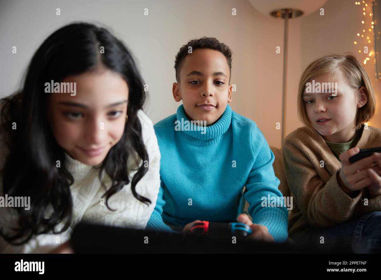 Children playing video games at home Stock Photo - Alamy