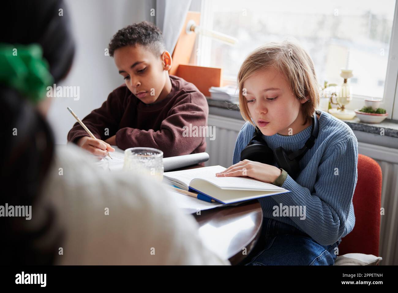 Two boys reading doing hi-res stock photography and images - Alamy