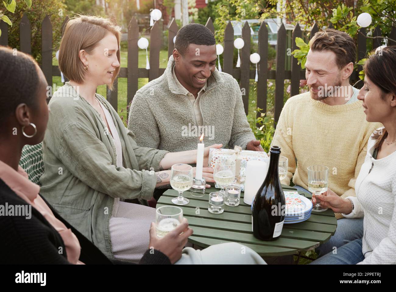 Happy friends having party in garden Stock Photo - Alamy