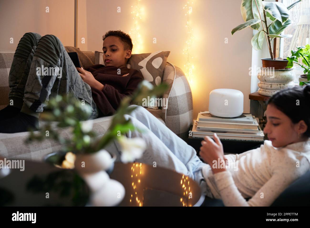 Children using phones at home Stock Photo - Alamy