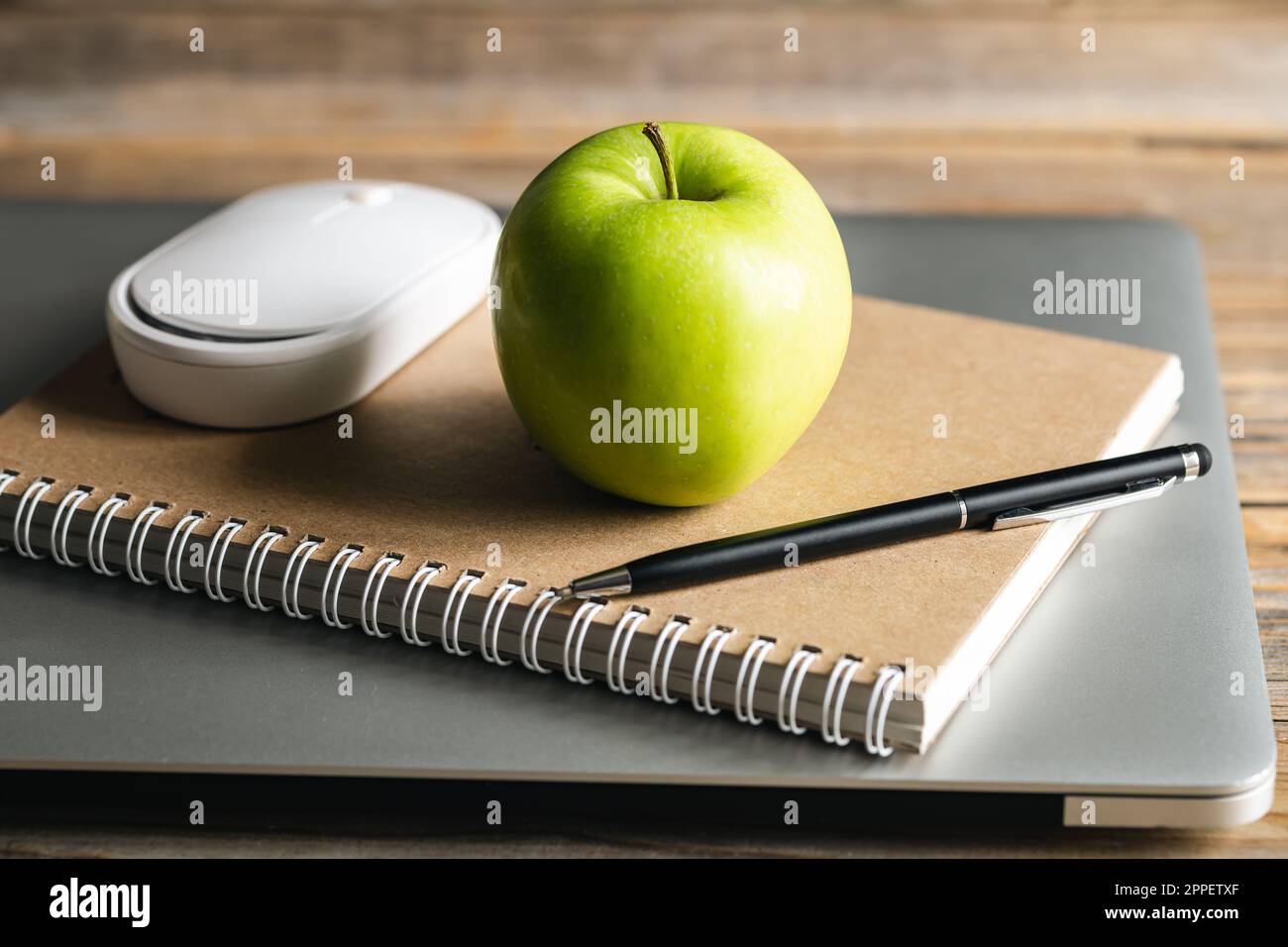 Apple, notepad and laptop on the desktop Stock Photo - Alamy