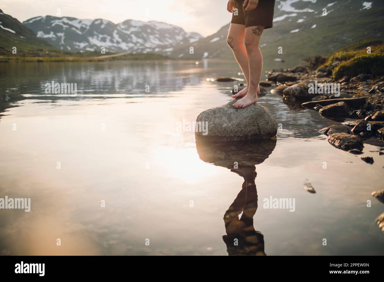 Person standing on rock hi-res stock photography and images - Alamy