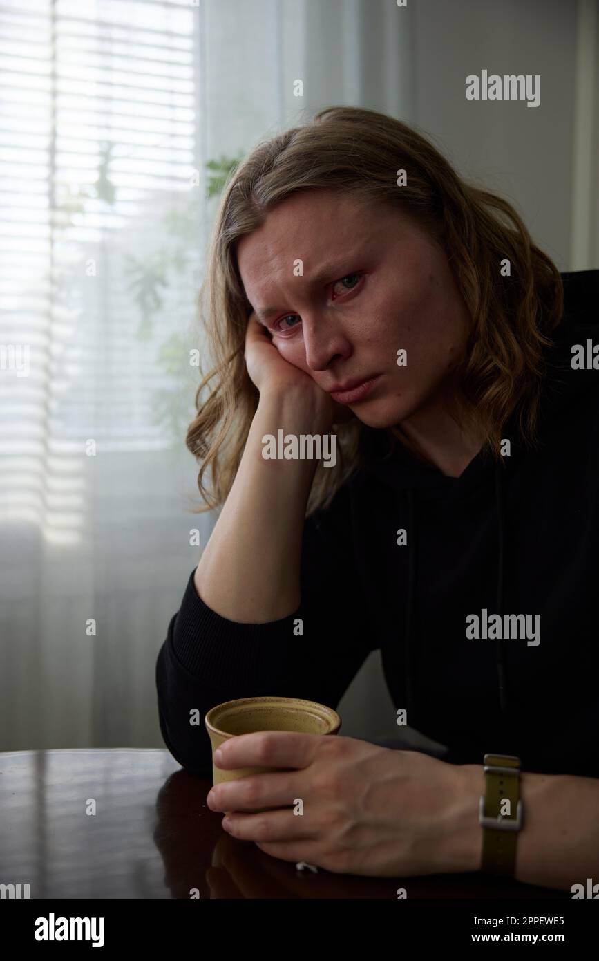 Crying woman looking at camera Stock Photo - Alamy