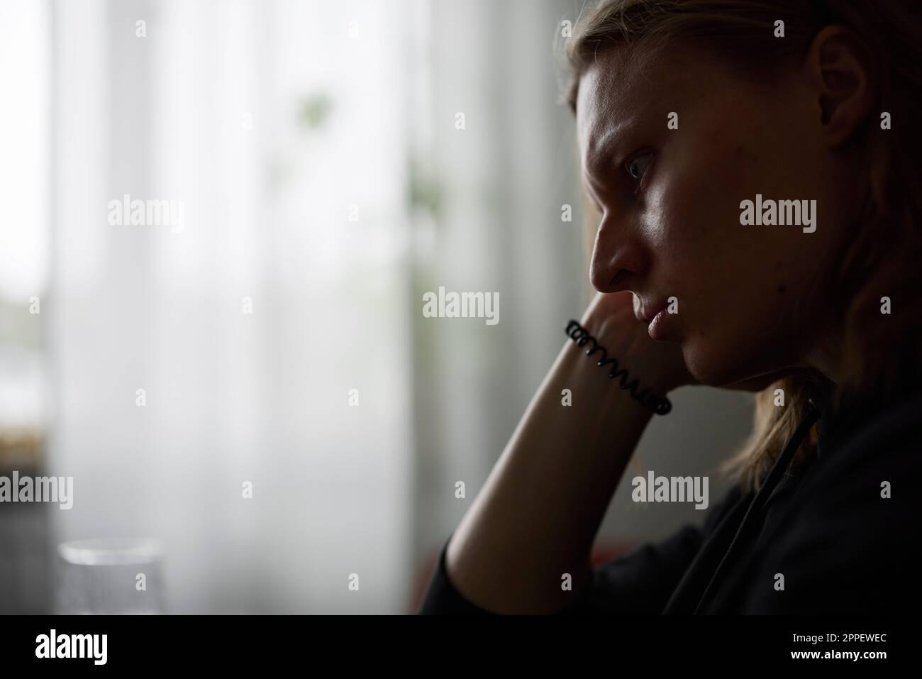 View of sad woman looking away Stock Photo - Alamy