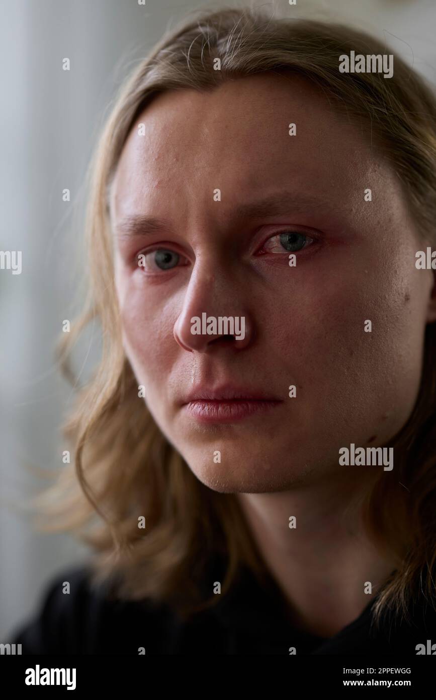 Portrait of crying woman looking at camera Stock Photo - Alamy