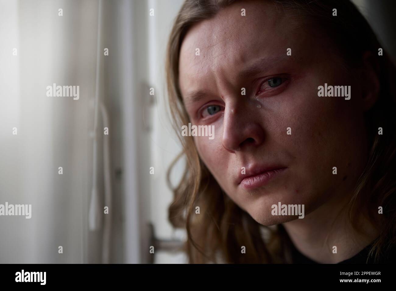 Portrait of crying woman looking at camera Stock Photo - Alamy