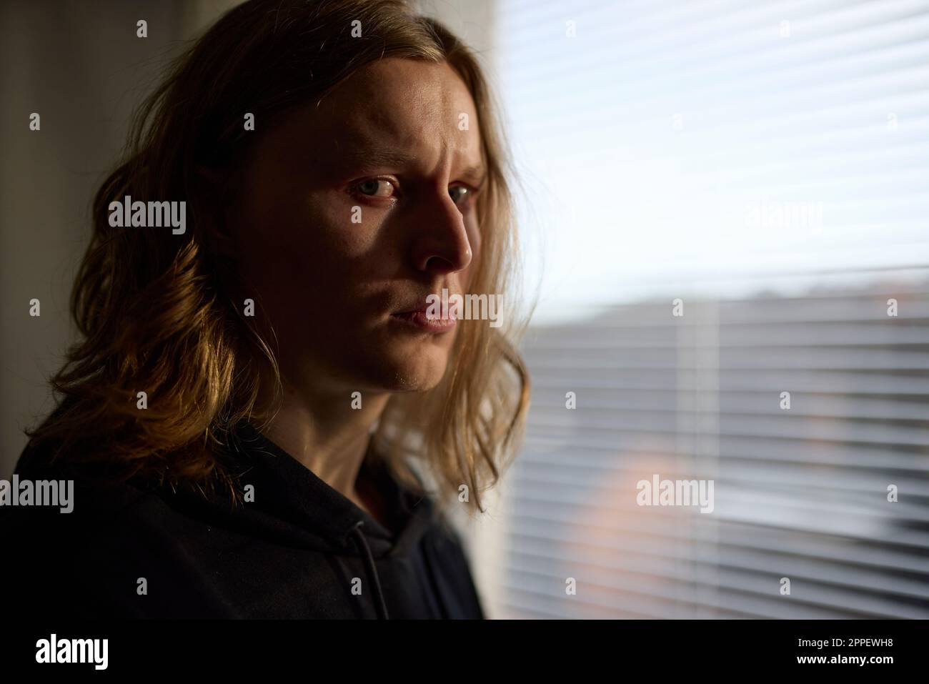 Portrait of sad woman looking at camera Stock Photo - Alamy