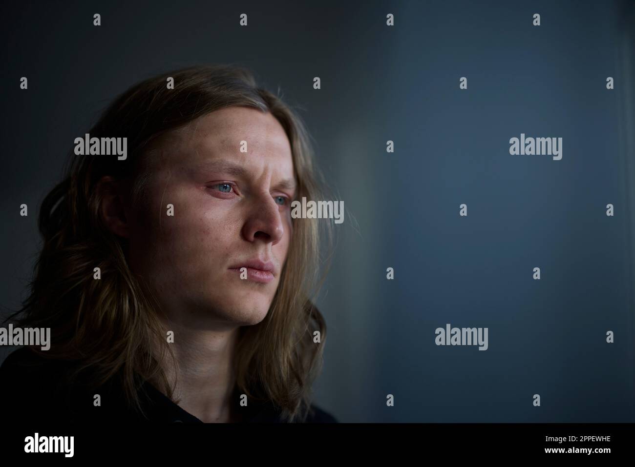 Portrait of crying woman looking away Stock Photo - Alamy