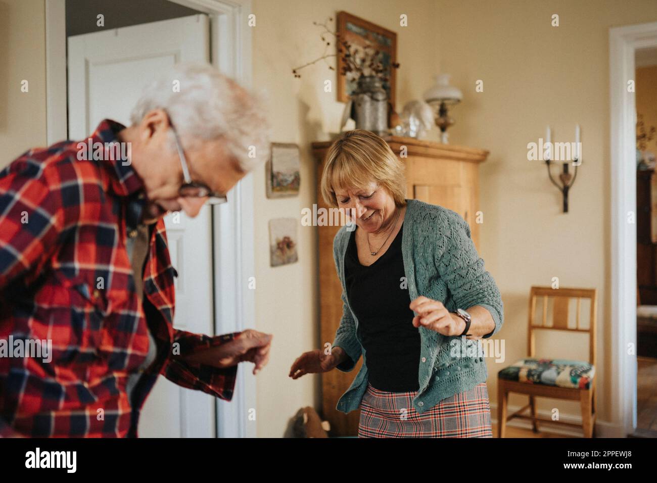 Senior couple dancing at home Stock Photo - Alamy