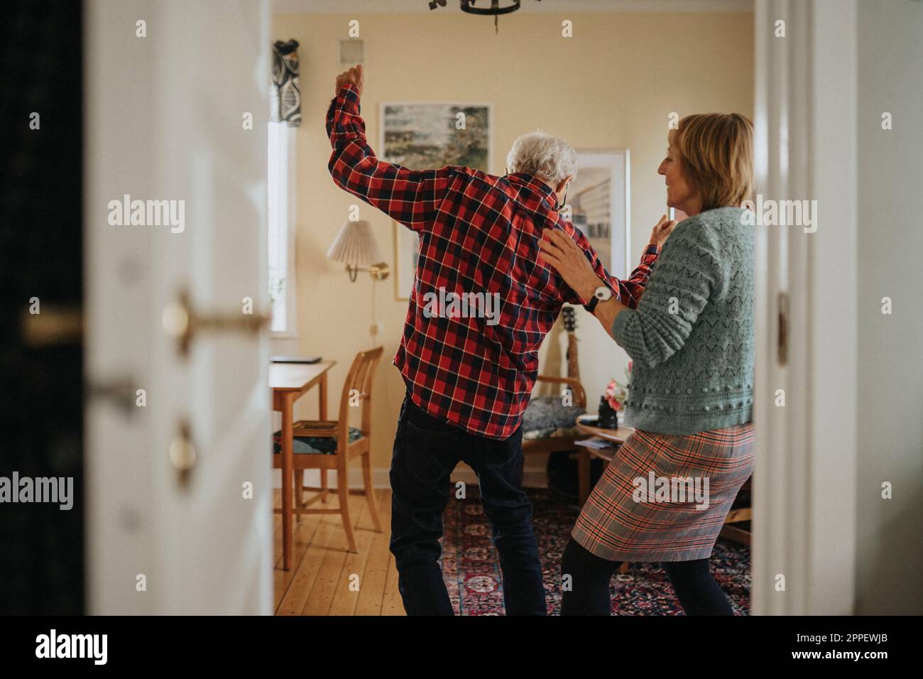 Senior couple dancing at home Stock Photo - Alamy