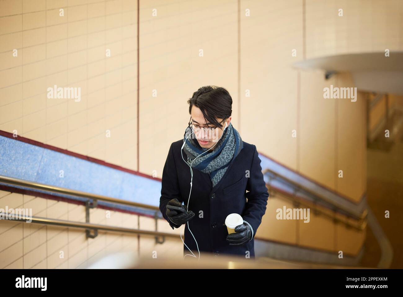 Smart man walking down steps hi-res stock photography and images - Alamy