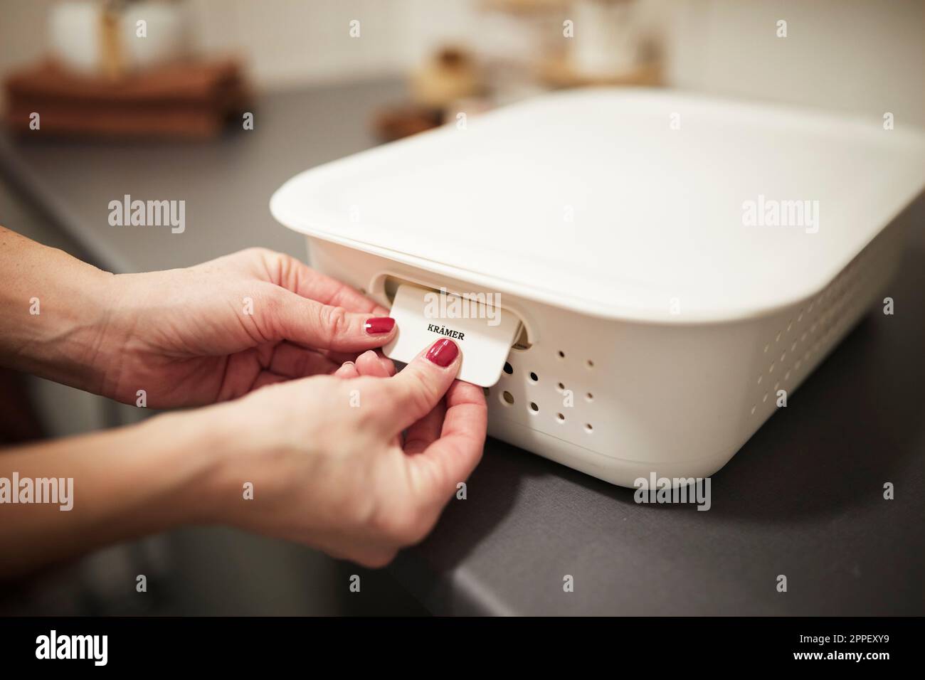 Woman's hands putting label on basket Stock Photo - Alamy Woman's hands putting label on basket Stock Photo - Alamy