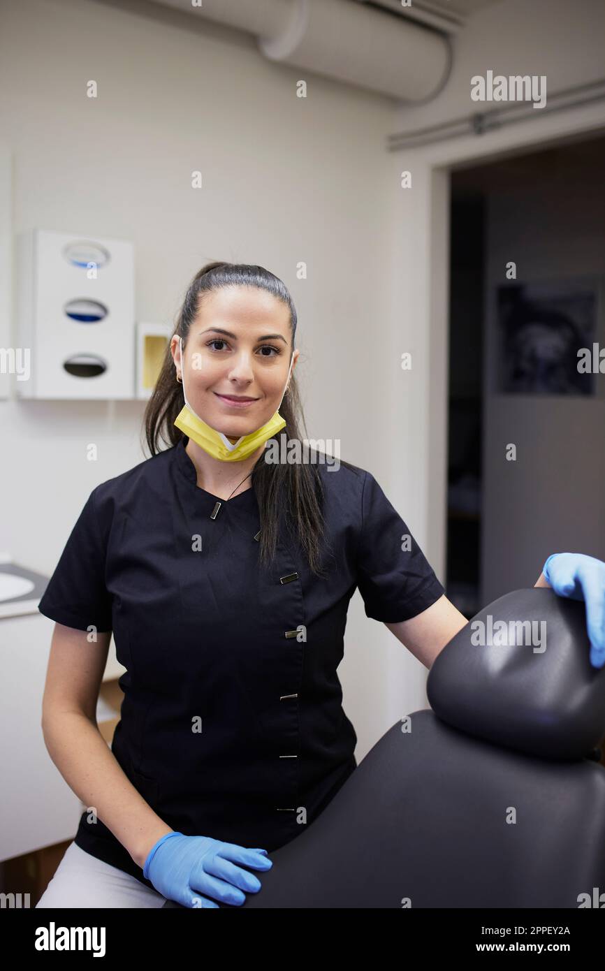 Female dentist standing in office Stock Photo - Alamy