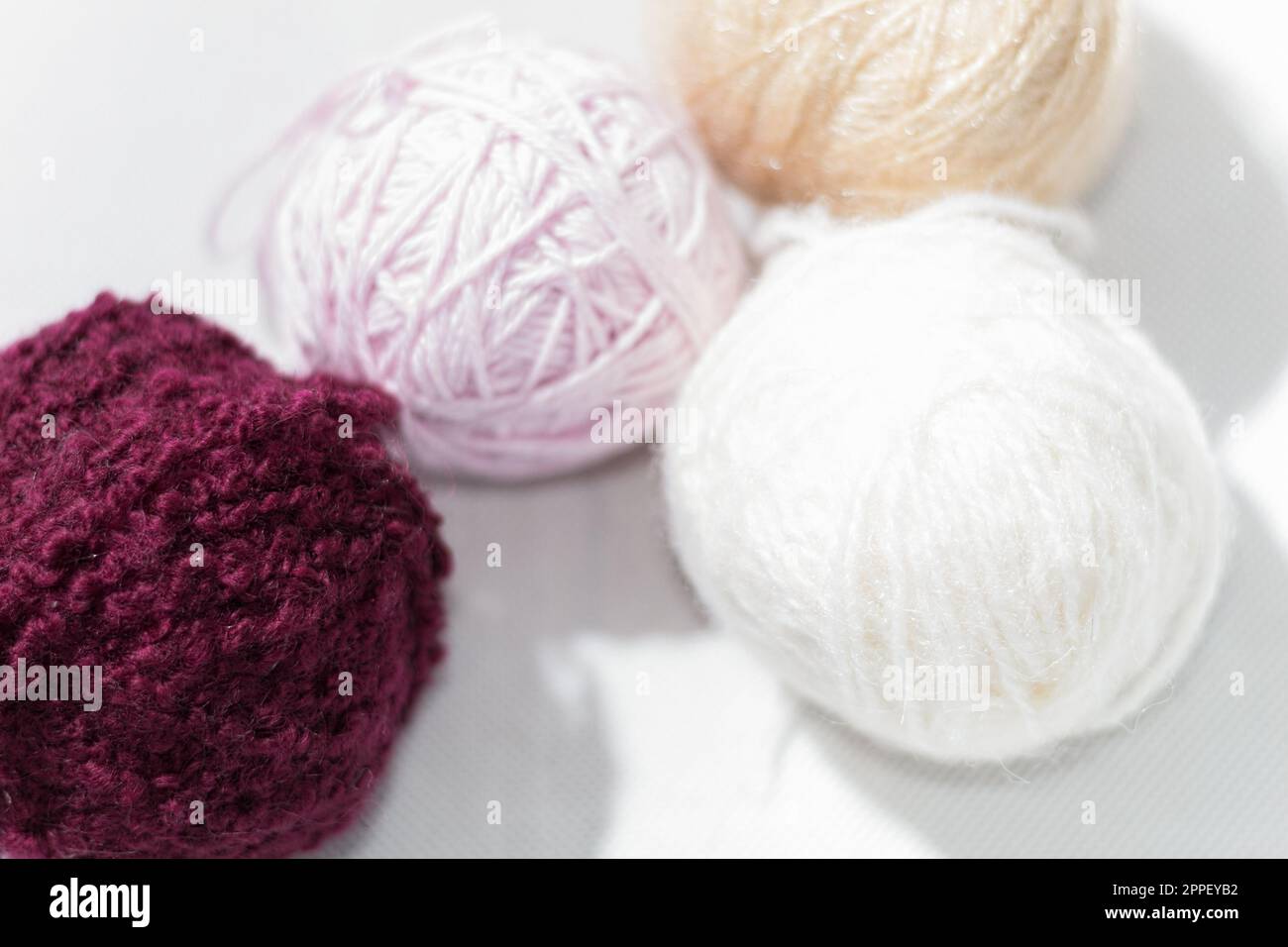 Multi-colored balls of knitting threads. Balls of colored yarn. Woolen ...