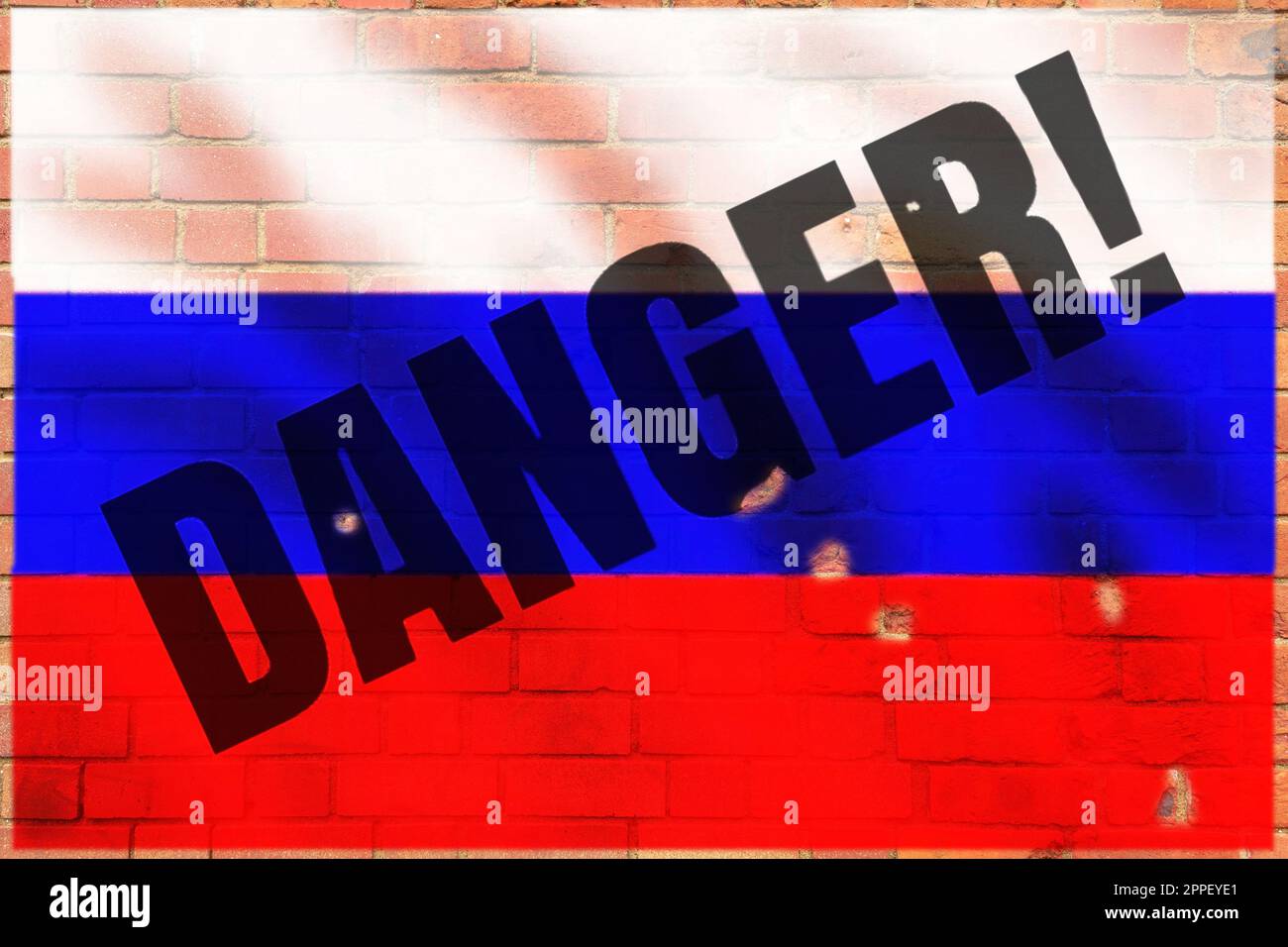 The flag of russia is painted on a brick wall. Danger text. Toxicity ...