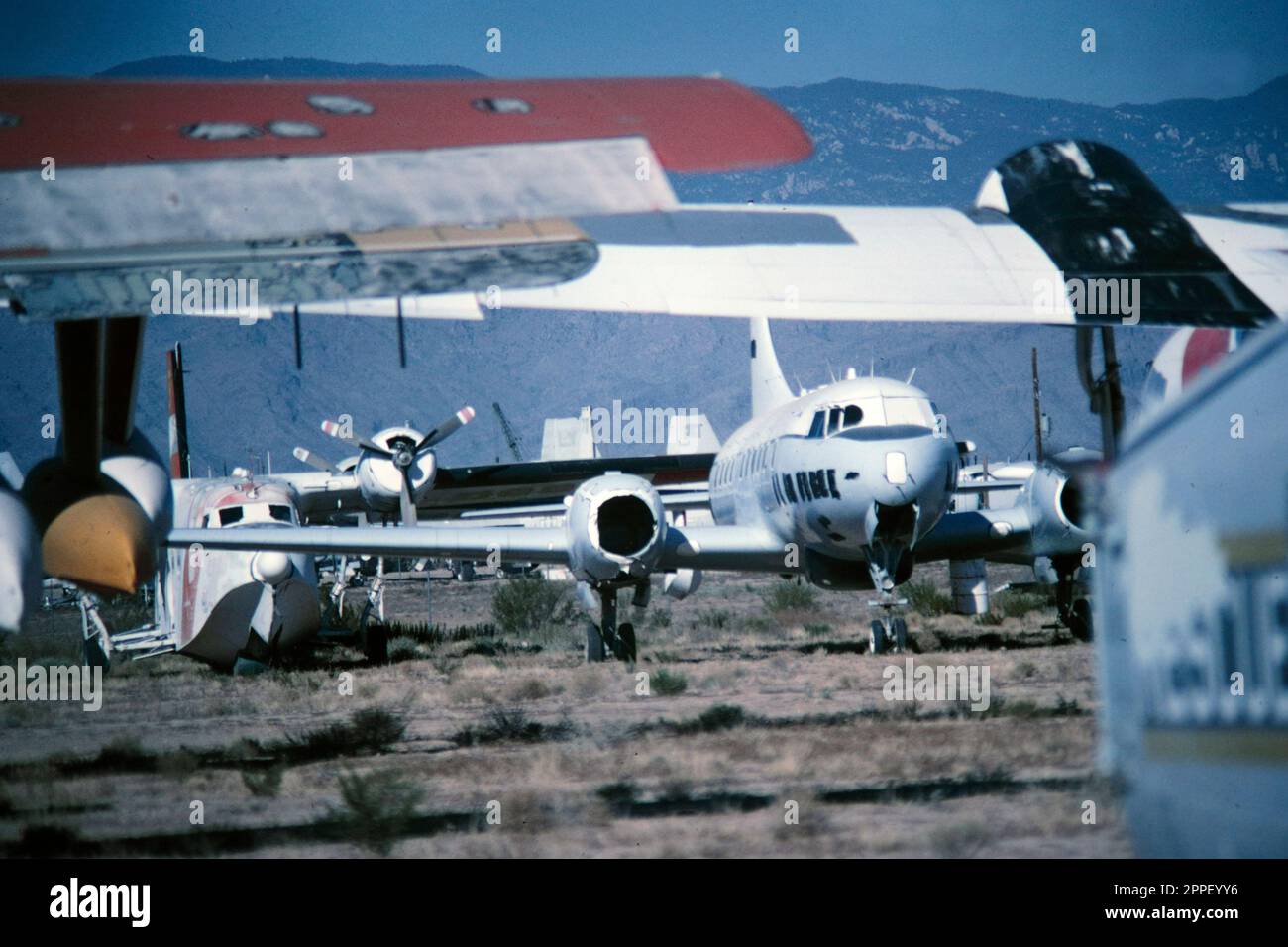 Mothballed United States Coast Guard aircraft parked in the desert near ...