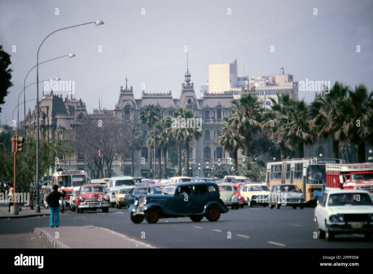 Street scene, with a busy road and old-fashioned cars, northern suburbs ...