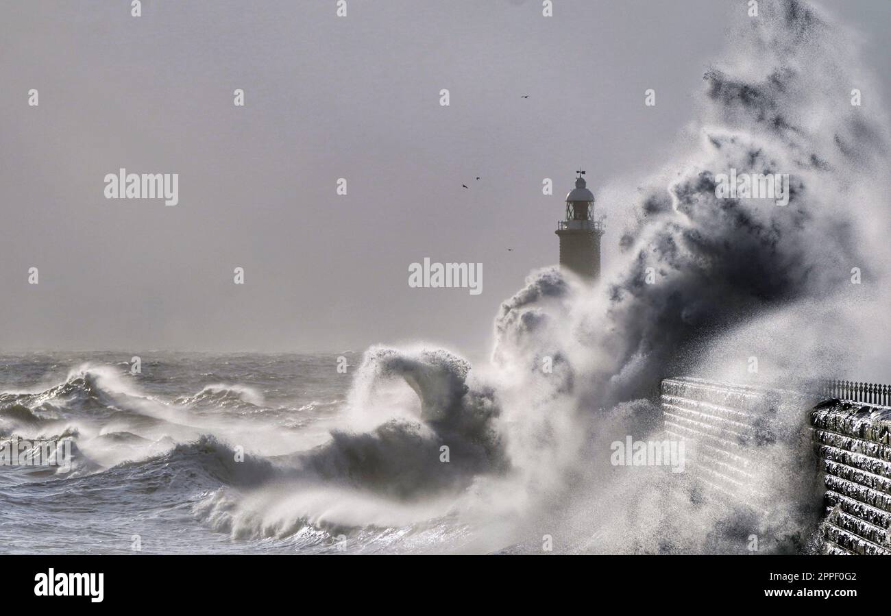 Waves crash over Tynemouth pier on the North East coast of England ...