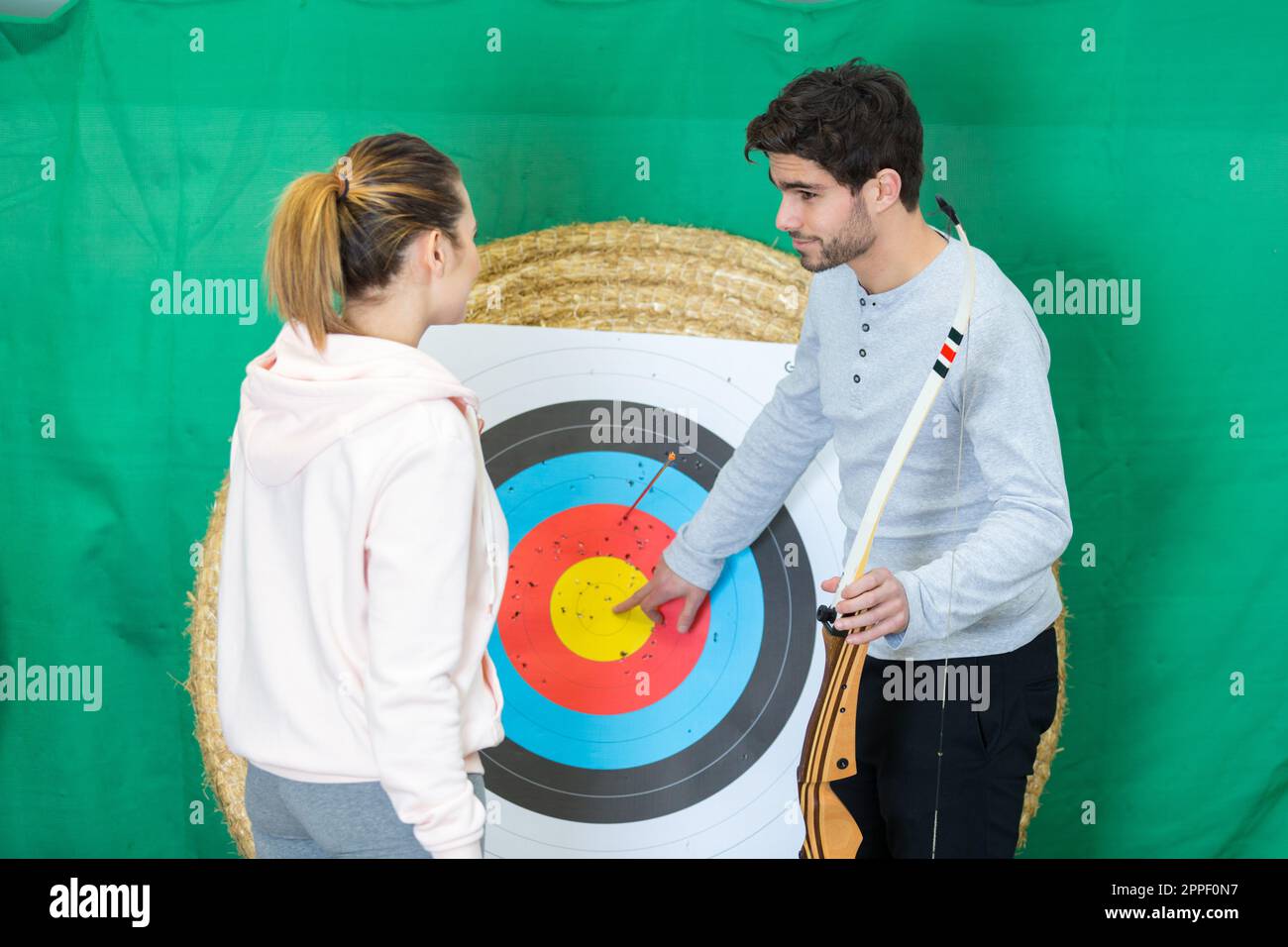 portrait of people during the archery lesson Stock Photo - Alamy
