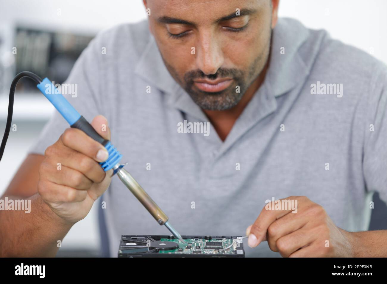 repairman working in technical support fixing computer Stock Photo - Alamy