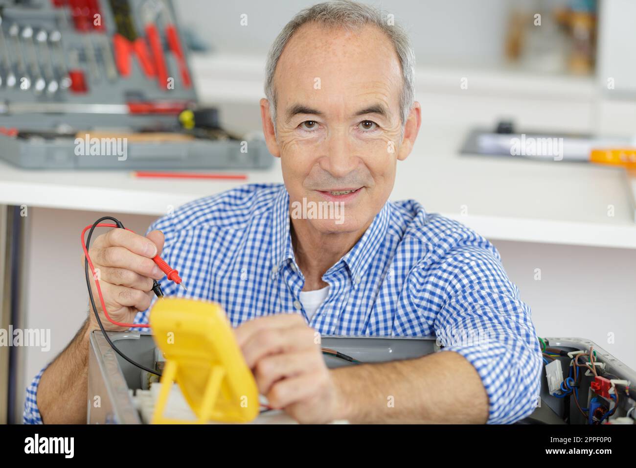 man is fixing a problem Stock Photo - Alamy