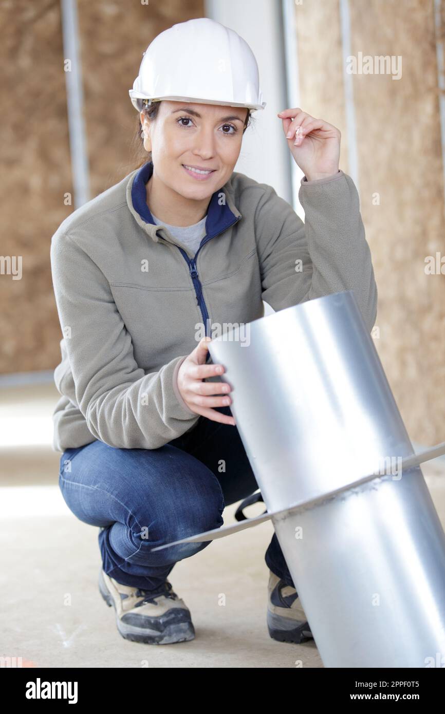 woman holding steel metal on site Stock Photo - Alamy