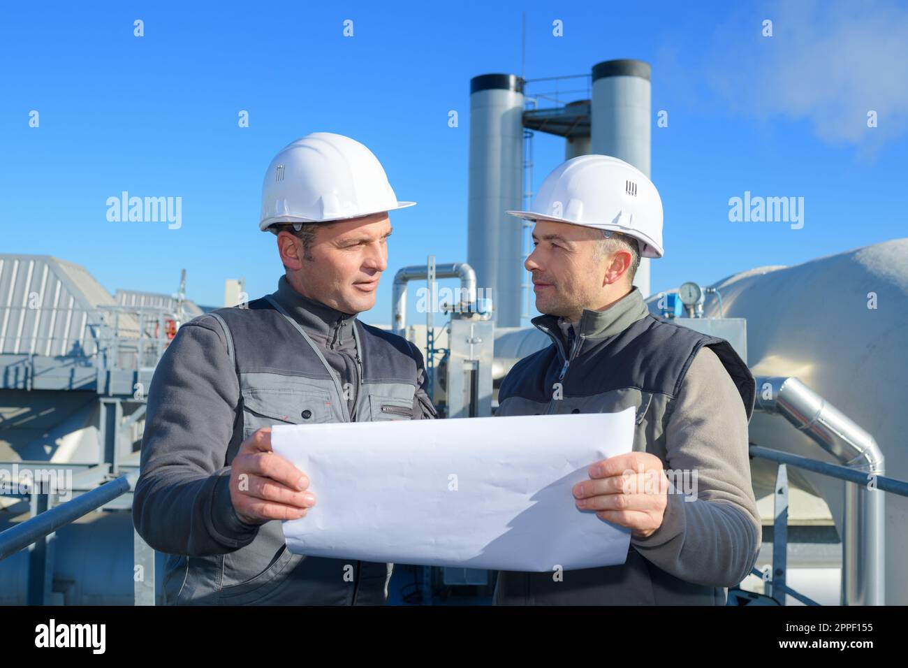 oil gas industrial engineers outdoors Stock Photo - Alamy
