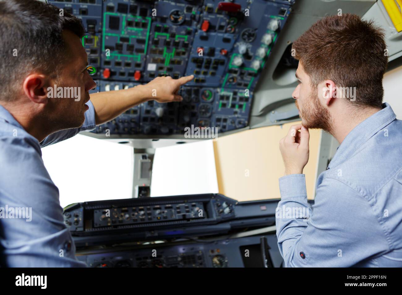 portrait of 2 man in a cockpit Stock Photo - Alamy