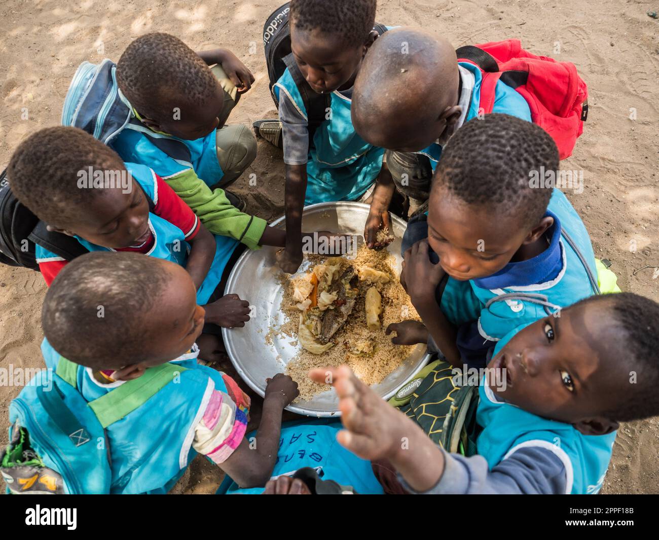 Senegal, Africa - Jan 2019: Senegalese children eat at school together ...