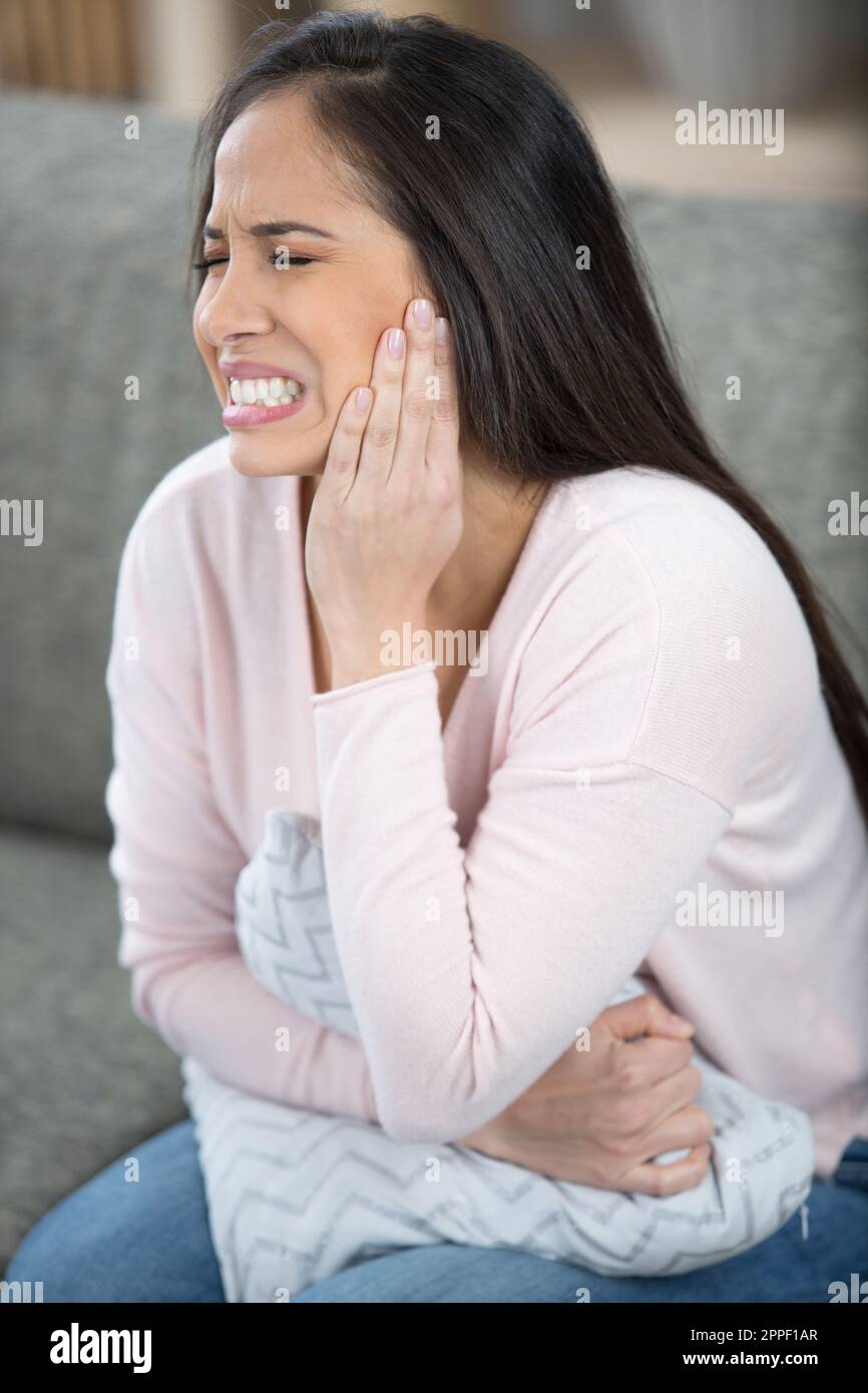 portrait of ill female with toothache Stock Photo - Alamy