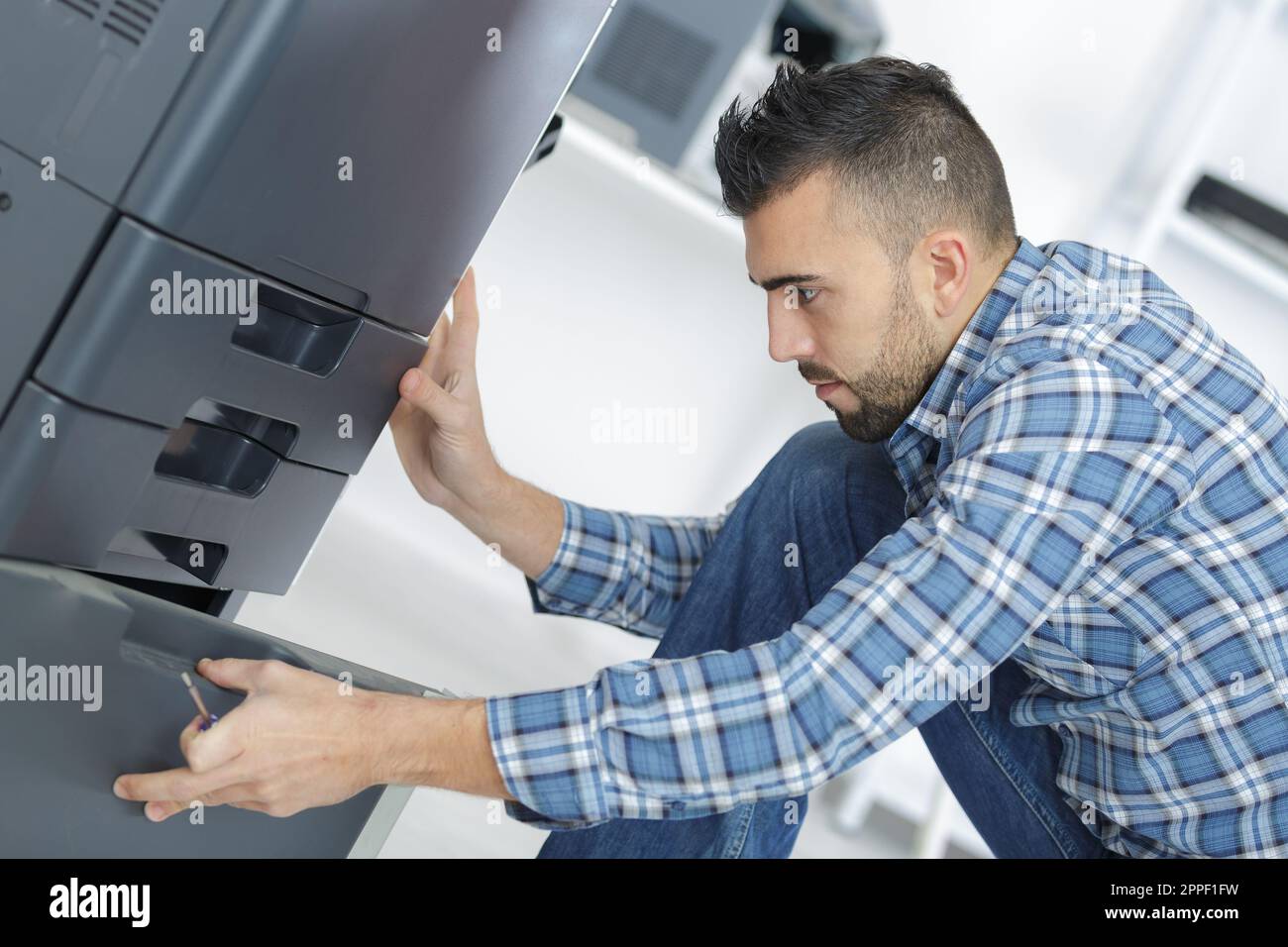 man opening an office cabinet Stock Photo - Alamy