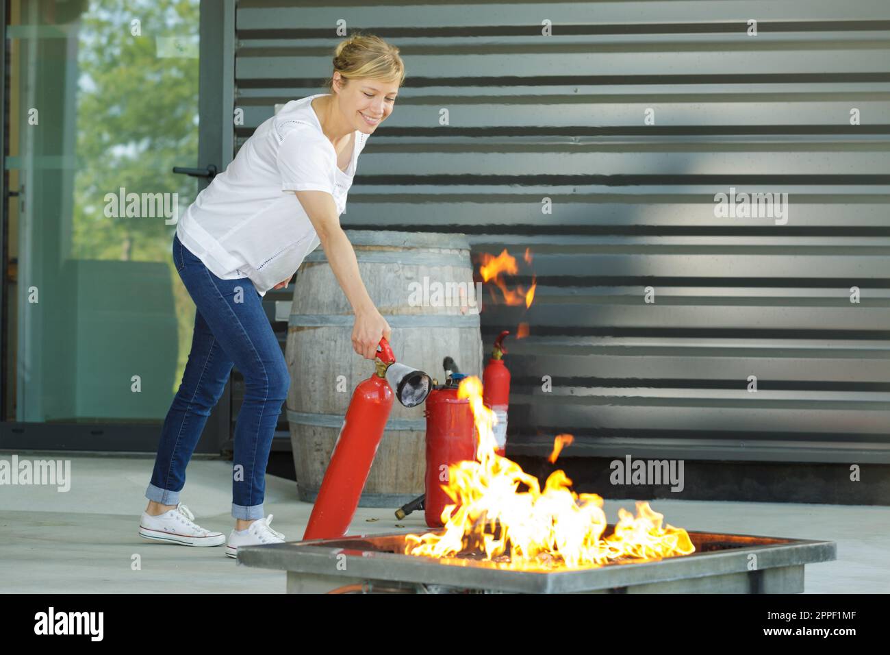 Beautiful woman fire extinguisher hi-res stock photography and images ...