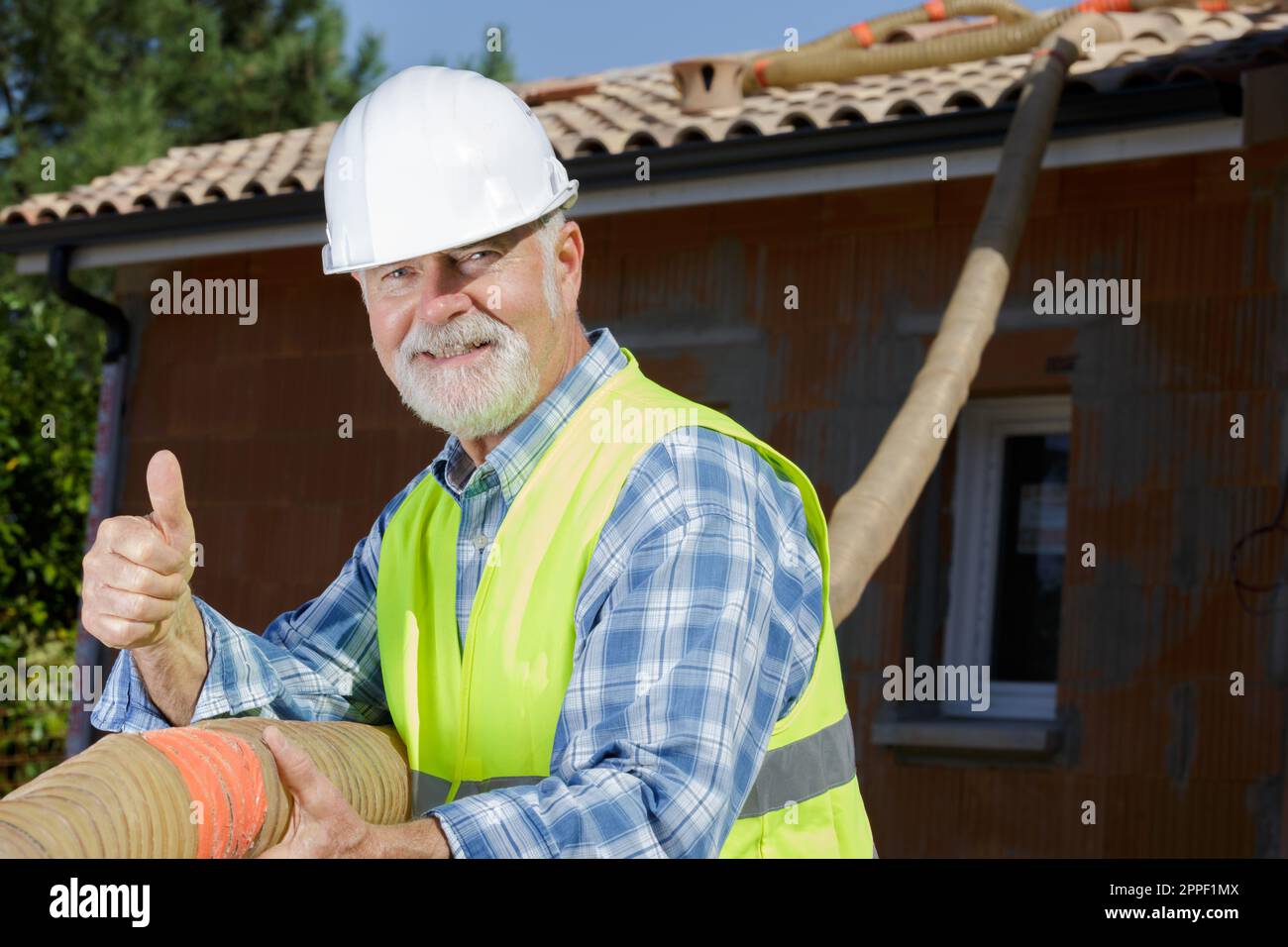 senior construction manager showing thumbs up Stock Photo - Alamy