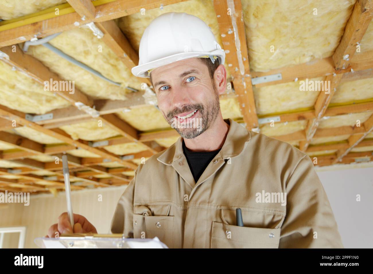 portrait of outgoing male holding clipboard Stock Photo - Alamy