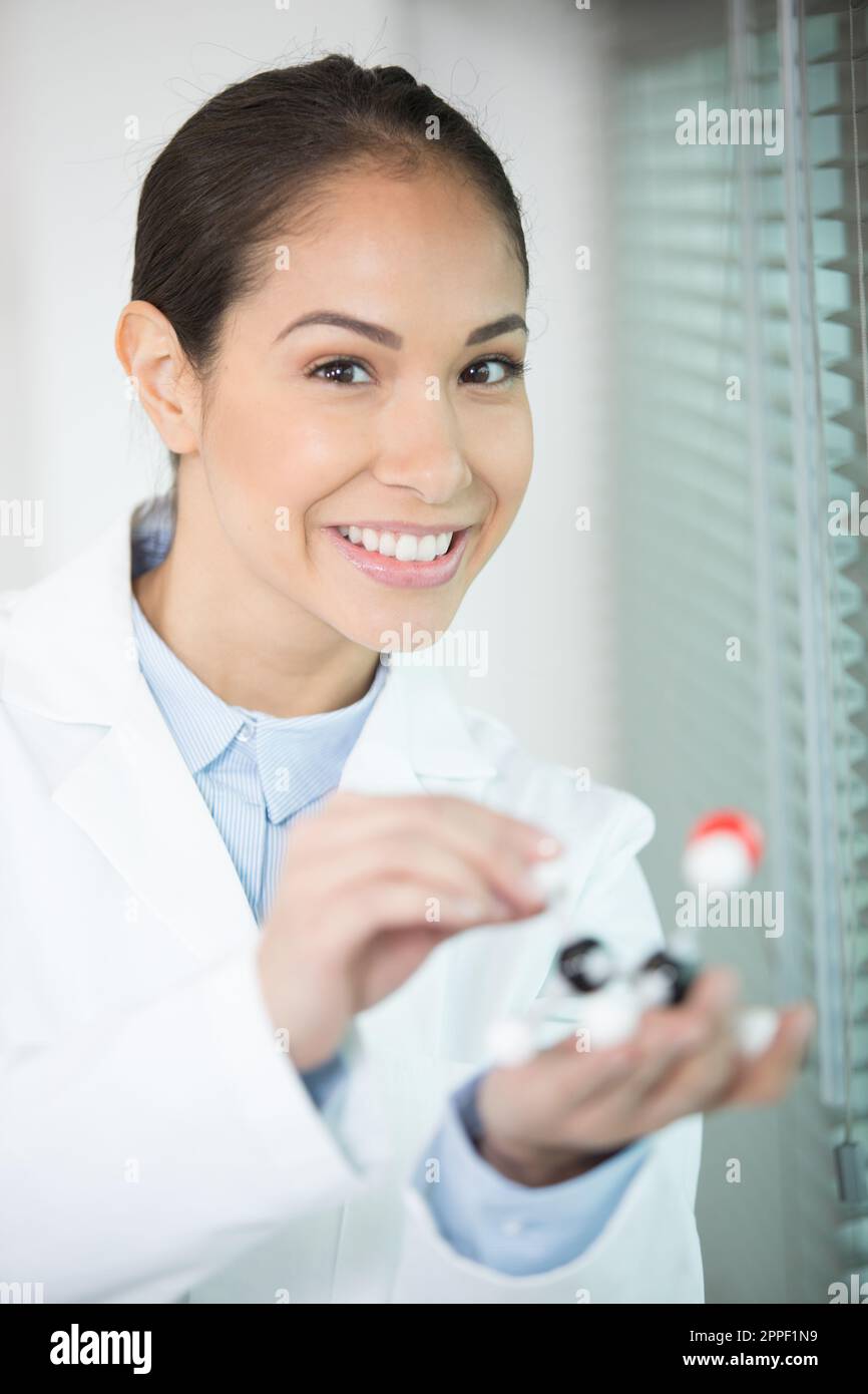 happy scientist holding samples with positive testing solution Stock ...