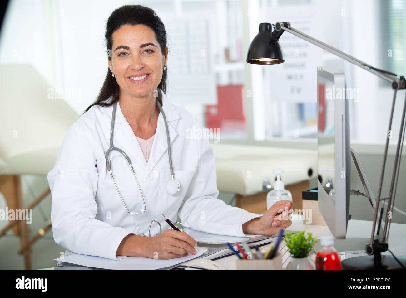portrait of happy medical doctor woman in office Stock Photo - Alamy