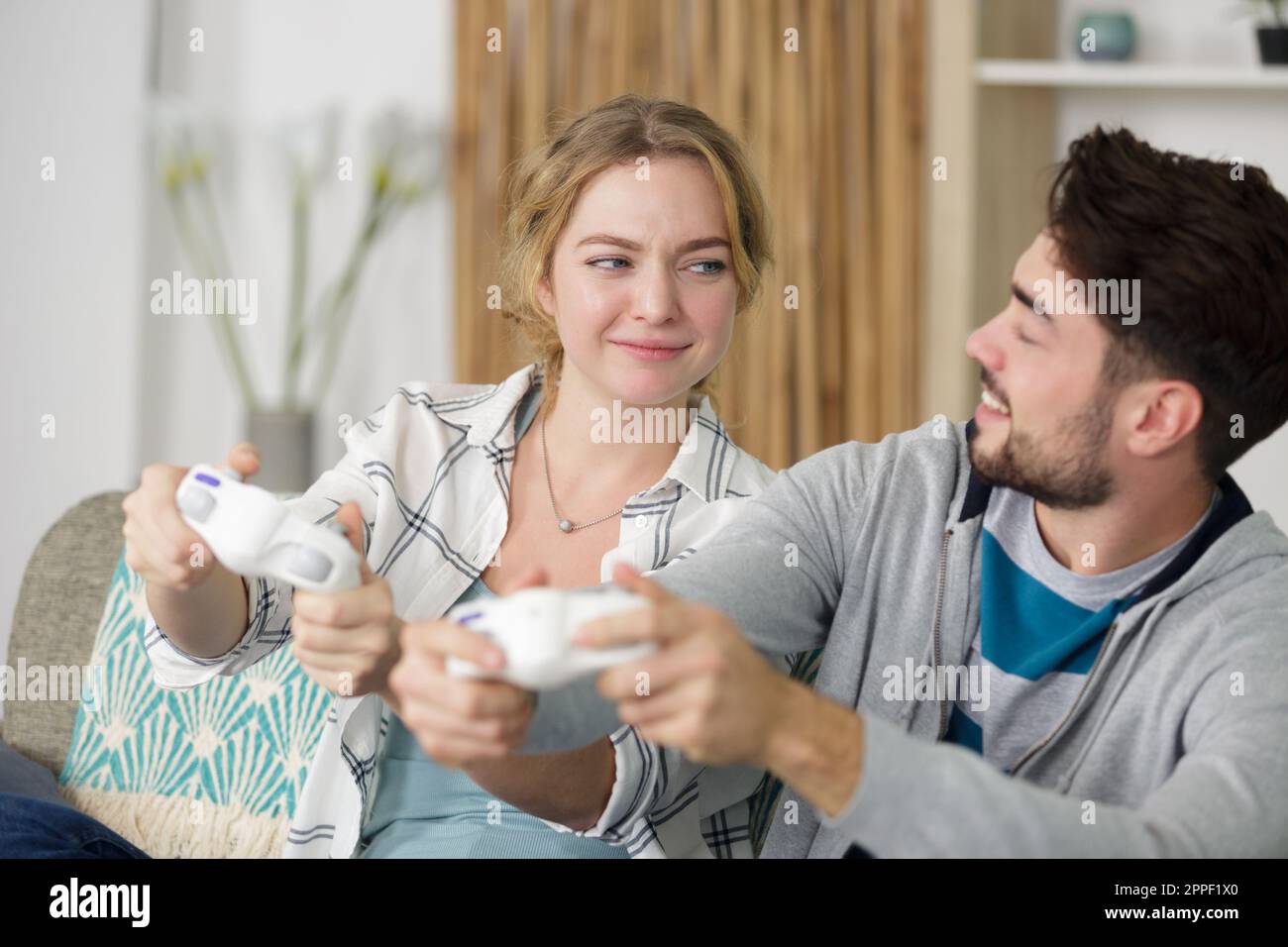 young couple playing with computer consoles Stock Photo - Alamy
