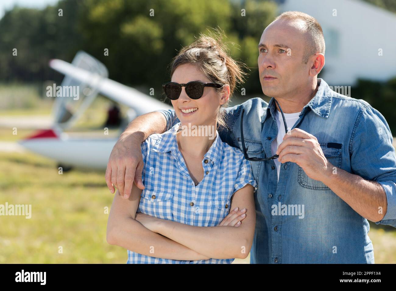 Couple plane hugging hi-res stock photography and images - Alamy