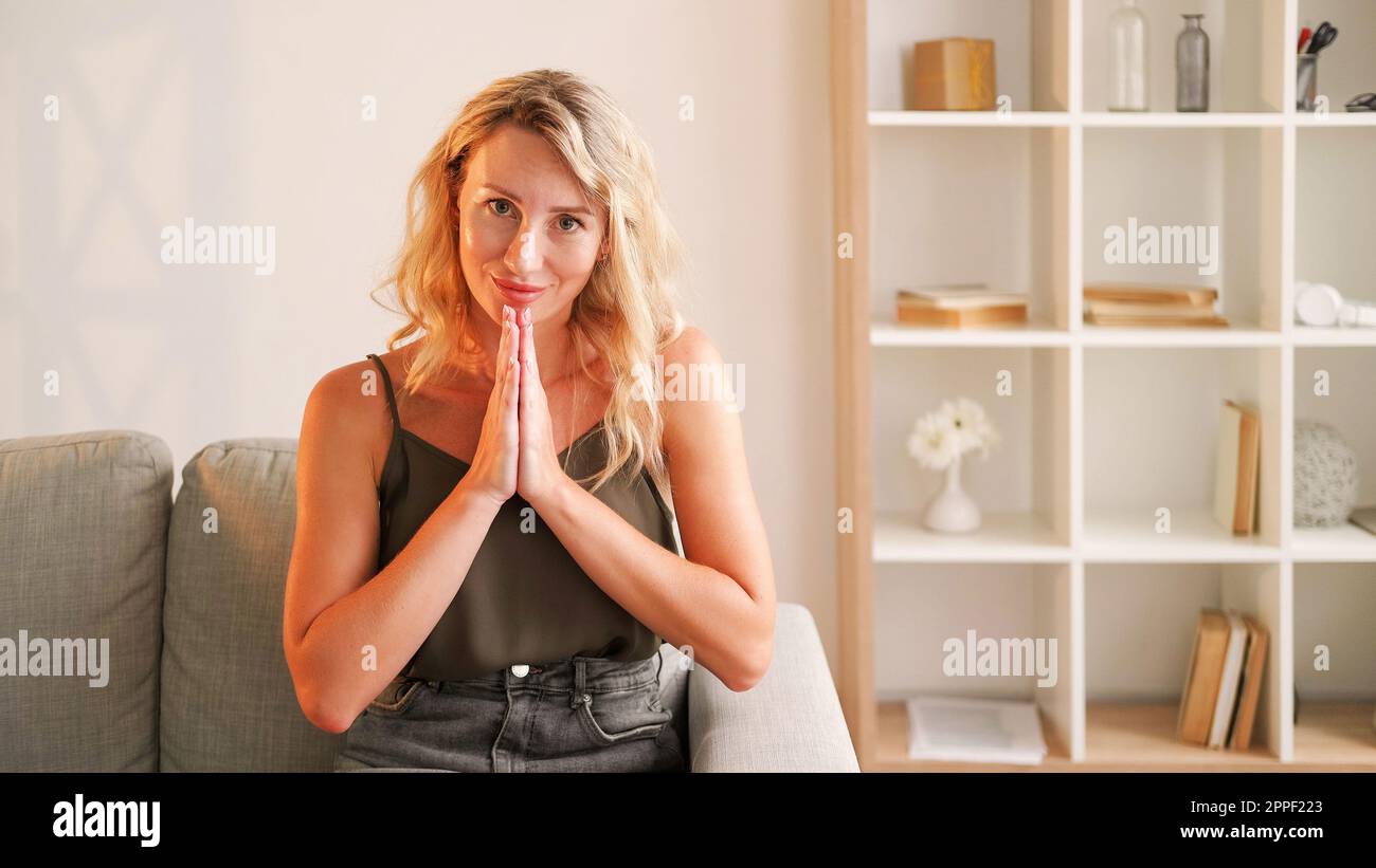 Begging woman hopeful request faithful feelings Stock Photo - Alamy