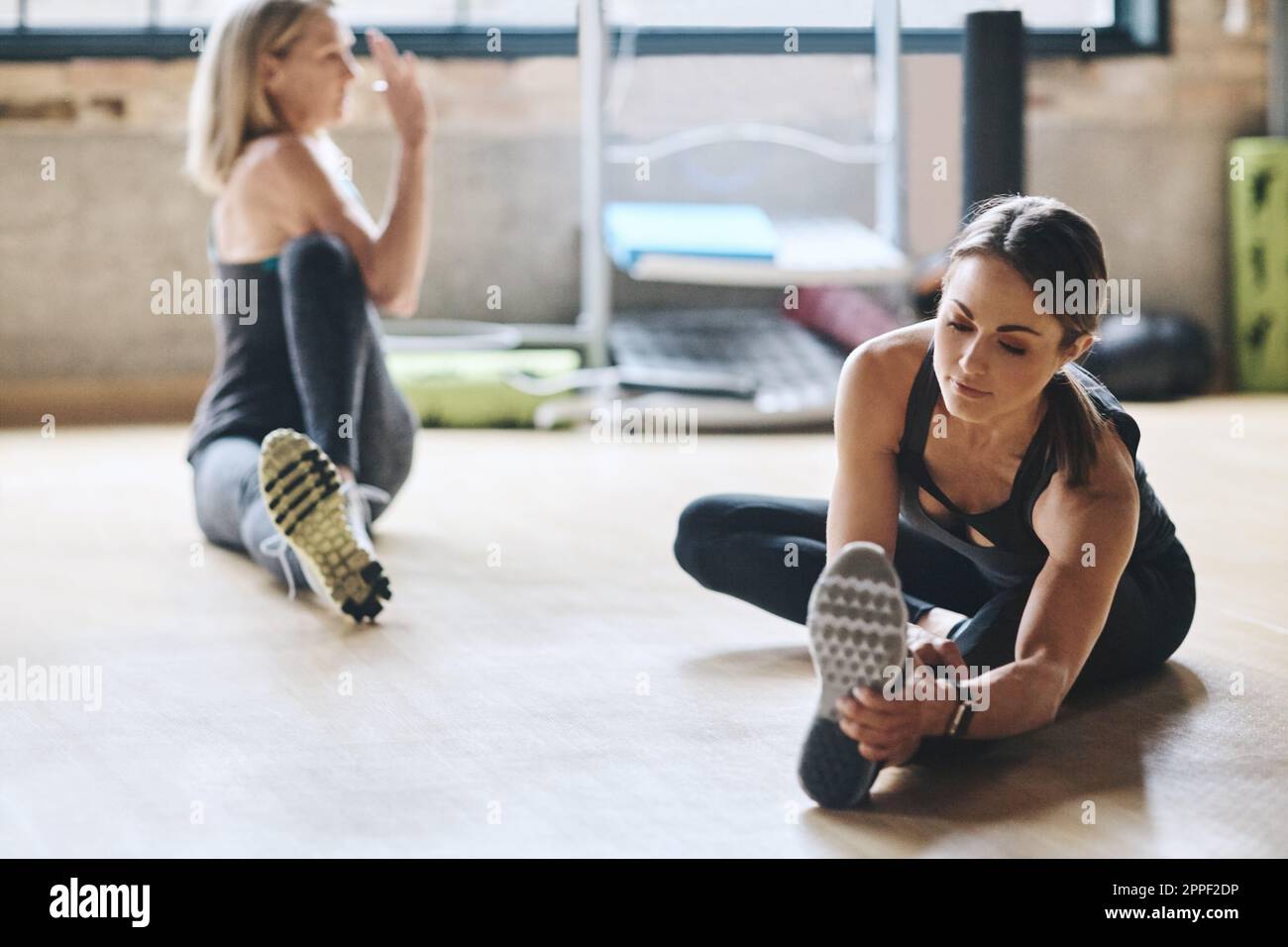 Stretch so you dont pull a muscle while working out. an attractive ...