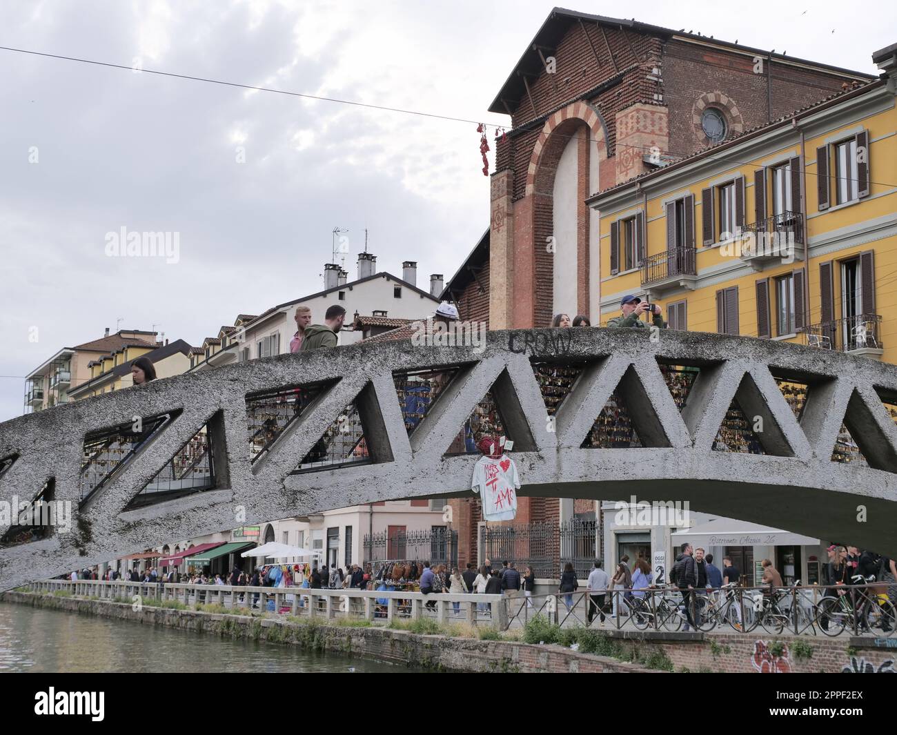 Milan many people crowd the streets along the Naviglio Grande during ...
