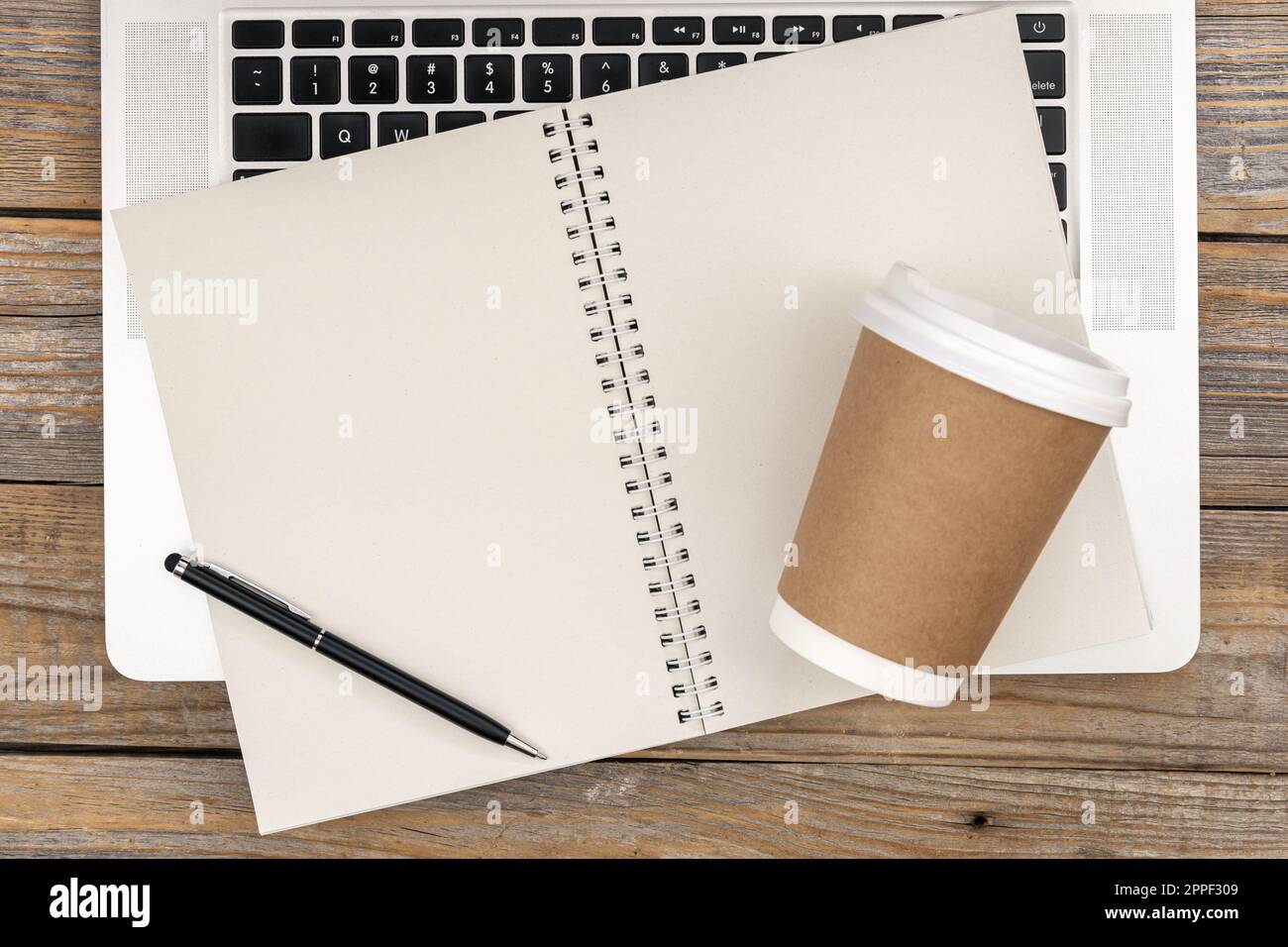 Laptop, notebook and disposable paper cup, top view Stock Photo - Alamy