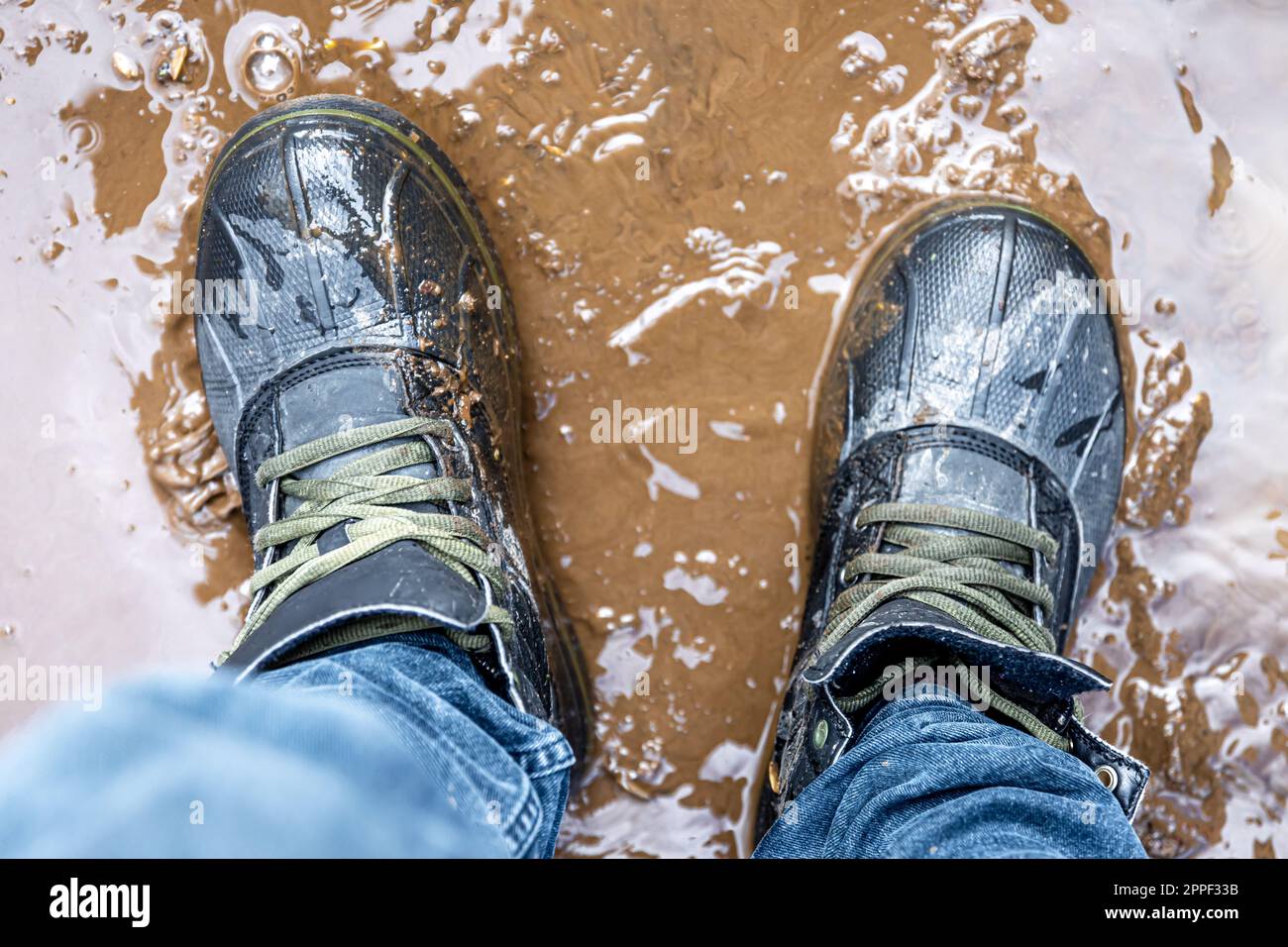 Pair of sneakers in mud hi-res stock photography and images - Alamy