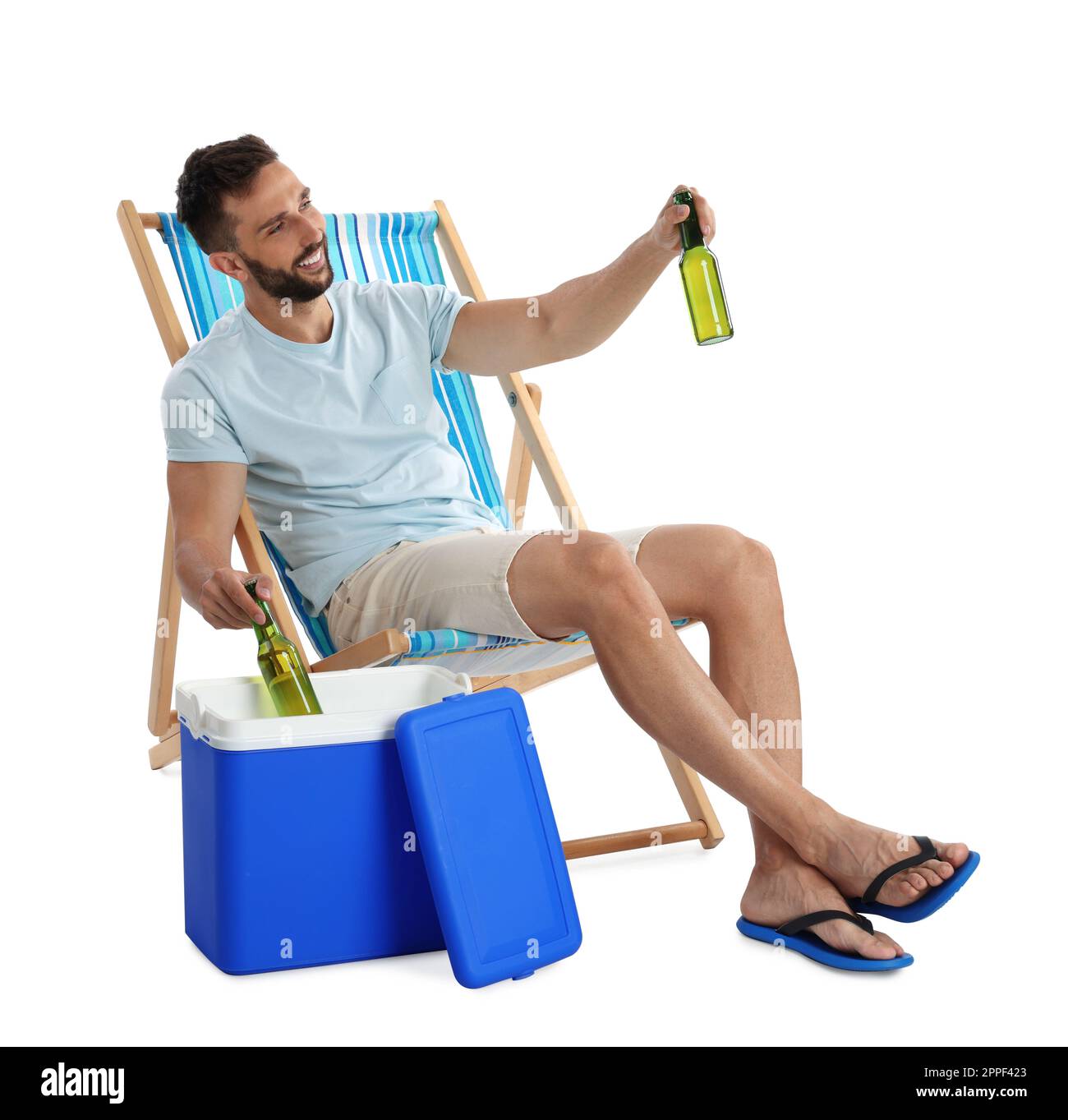 Happy man with bottles of beer near cool box on white background Stock ...